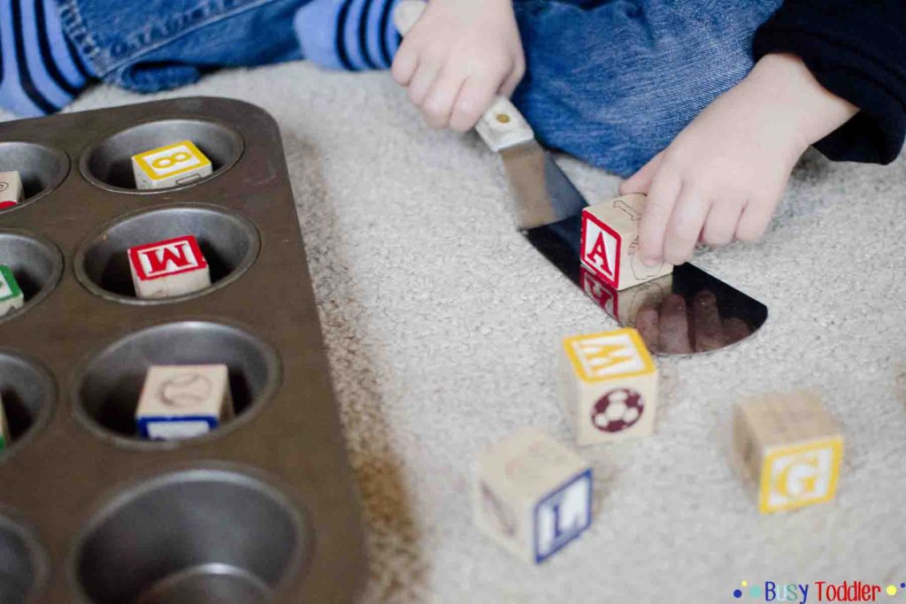 Block Carry: A Simple Indoor Activity - Busy Toddler