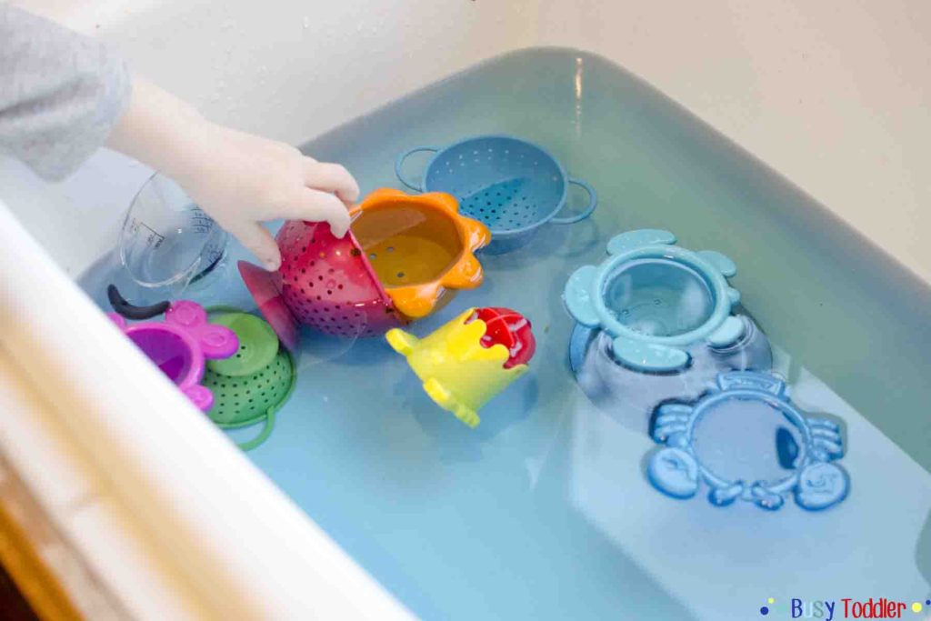 Colander Pour in the Kitchen Sink - Busy Toddler