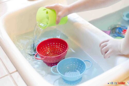 Colander Pour in the Kitchen Sink - Busy Toddler