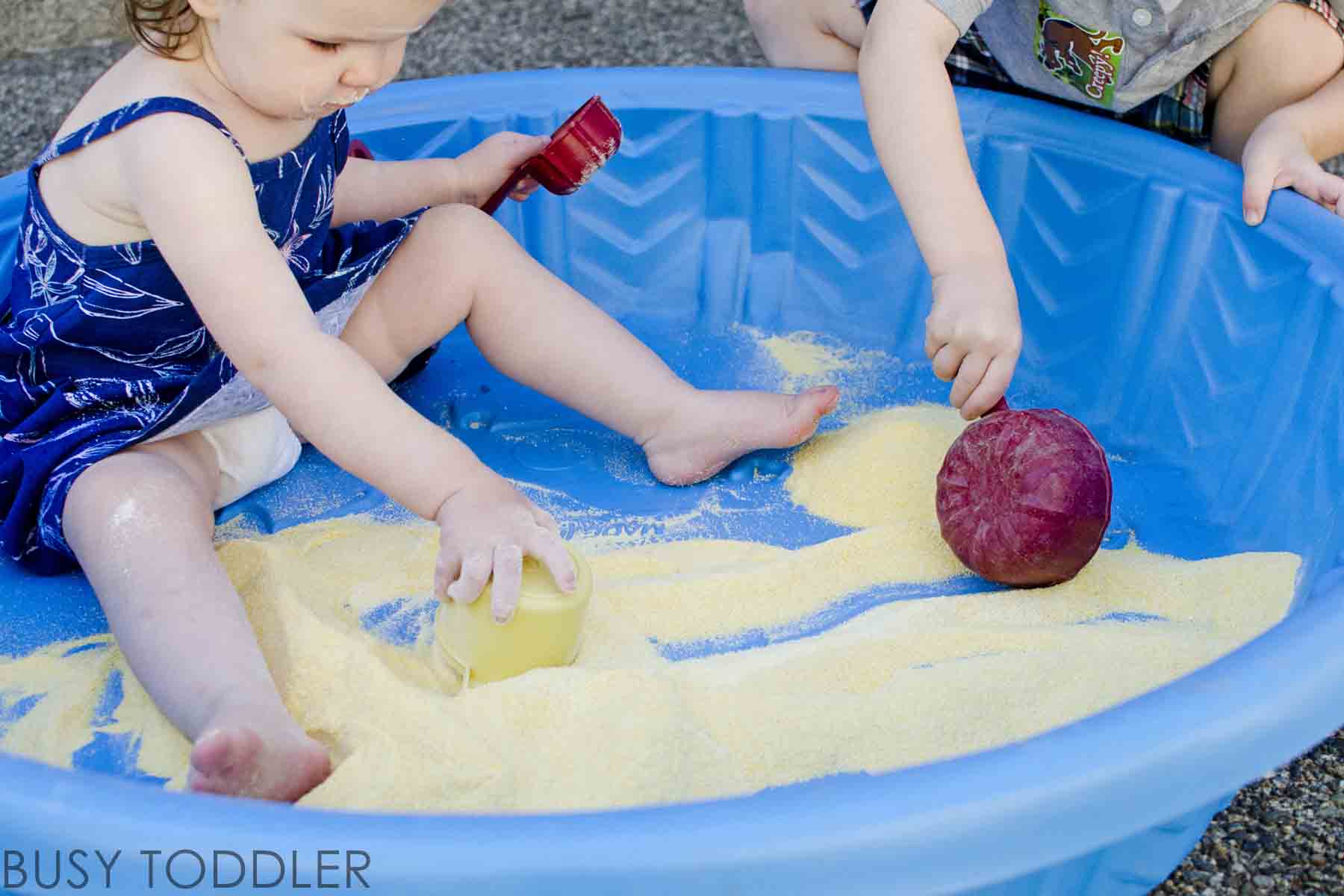 Corn Meal Sensory Pool - Busy Toddler
