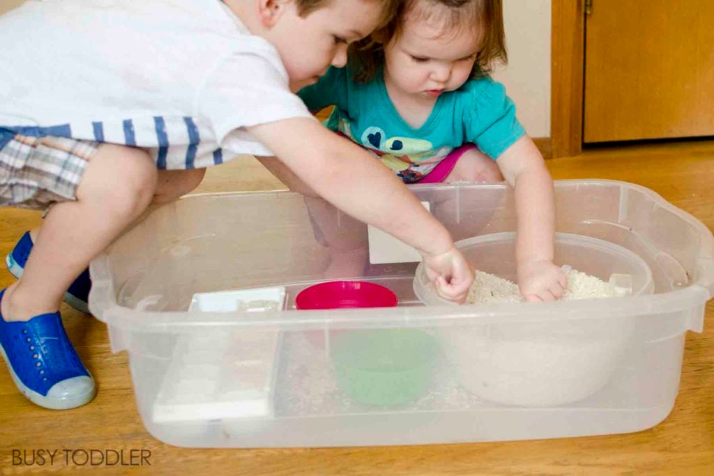 Scooping Rice Sensory Bin - Busy Toddler