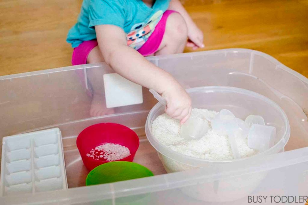 Scooping Rice Sensory Bin - Busy Toddler