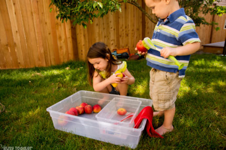 Apple Washing Bin Sensory Activity - Busy Toddler