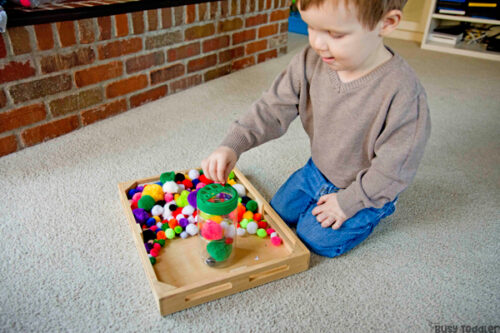 Pom Pom Pushing: Easy Toddler Activity - Busy Toddler