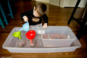 Funnels and Rice: A Perfect Sensory Bin - Busy Toddler