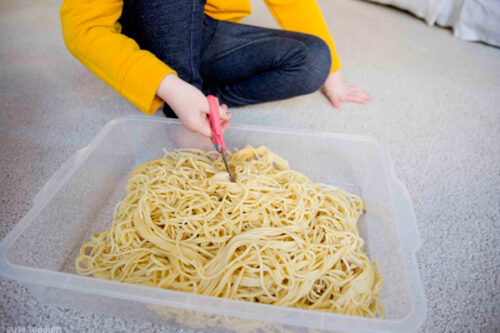 Spaghetti Cutting Bin - Scissor Skills Activity - Busy Toddler