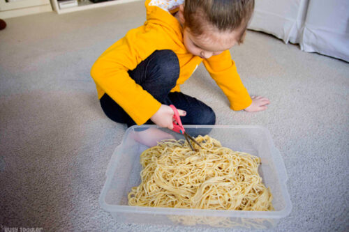 Spaghetti Cutting Bin - Scissor Skills Activity - Busy Toddler