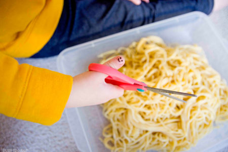 Spaghetti Cutting Bin - Scissor Skills Activity - Busy Toddler