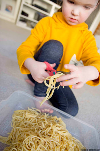 Spaghetti Cutting Bin - Scissor Skills Activity - Busy Toddler