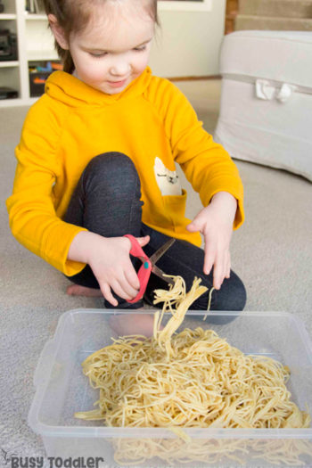 Spaghetti Cutting Bin - Scissor Skills Activity - Busy Toddler
