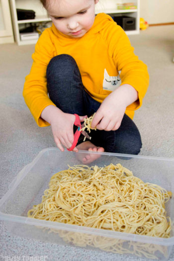 Spaghetti Cutting Bin - Scissor Skills Activity - Busy Toddler