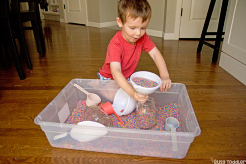 How to Make a Rainbow Rice Sensory Bin - Busy Toddler