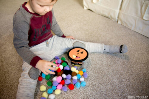 Feed the Pumpkin Halloween Toddler Activity - Busy Toddler