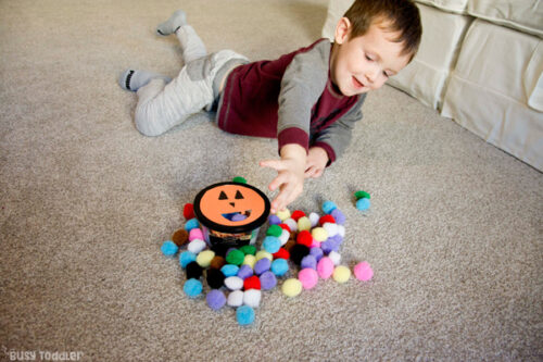 Feed the Pumpkin Halloween Toddler Activity - Busy Toddler