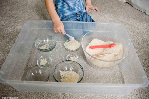Rice Bin Toddler Activity: Scoop and Transfer - Busy Toddler