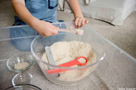 Rice Bin Toddler Activity: Scoop and Transfer - Busy Toddler