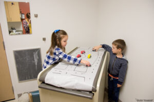 Use a Doctor's Office Road to entertain kids will waiting - Busy Toddler