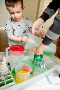 Rainbow Pouring Station Kids Activity - Busy Toddler