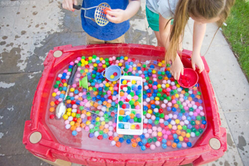 Pom Pom Water Table: An Outdoor Activity - Busy Toddler