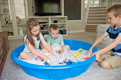 Shredded Paper Sensory Bin Activity - Busy Toddler