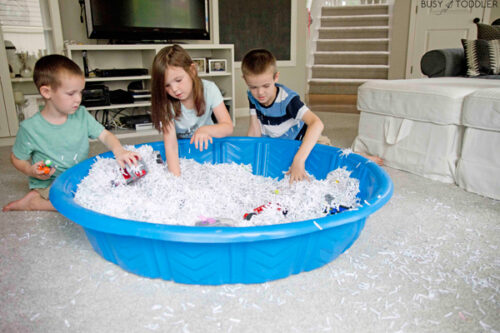 Shredded Paper Sensory Bin Activity - Busy Toddler