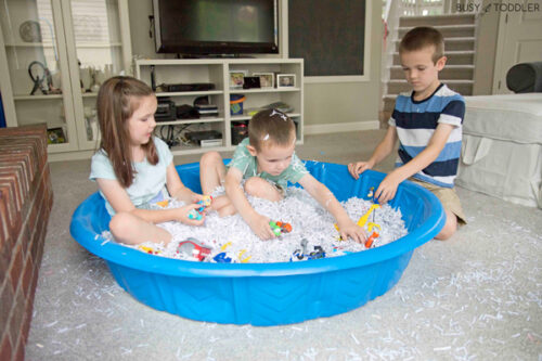 Shredded Paper Sensory Bin Activity - Busy Toddler