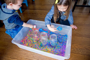 How to Use Rainbow Rice with Toddlers - Busy Toddler