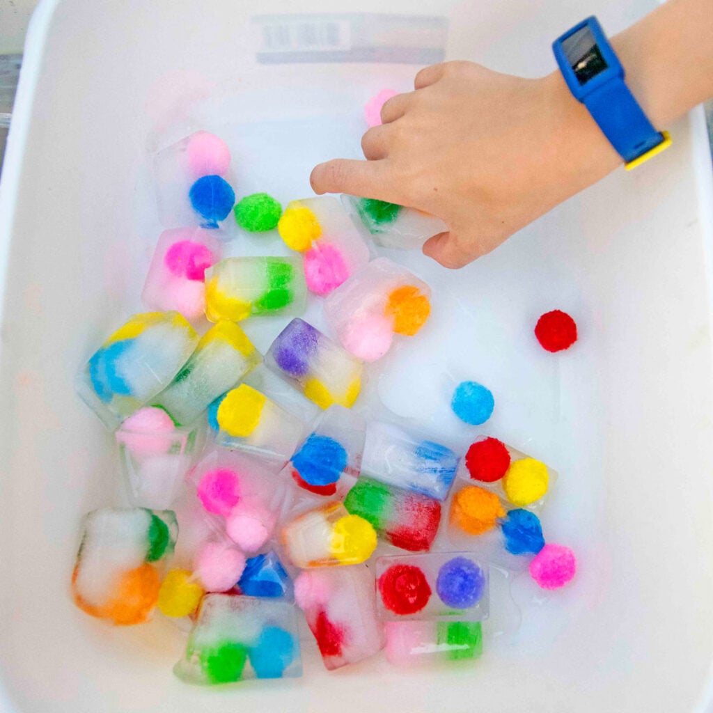 Frozen Pom Pom Balls Outdoor Activity - Busy Toddler