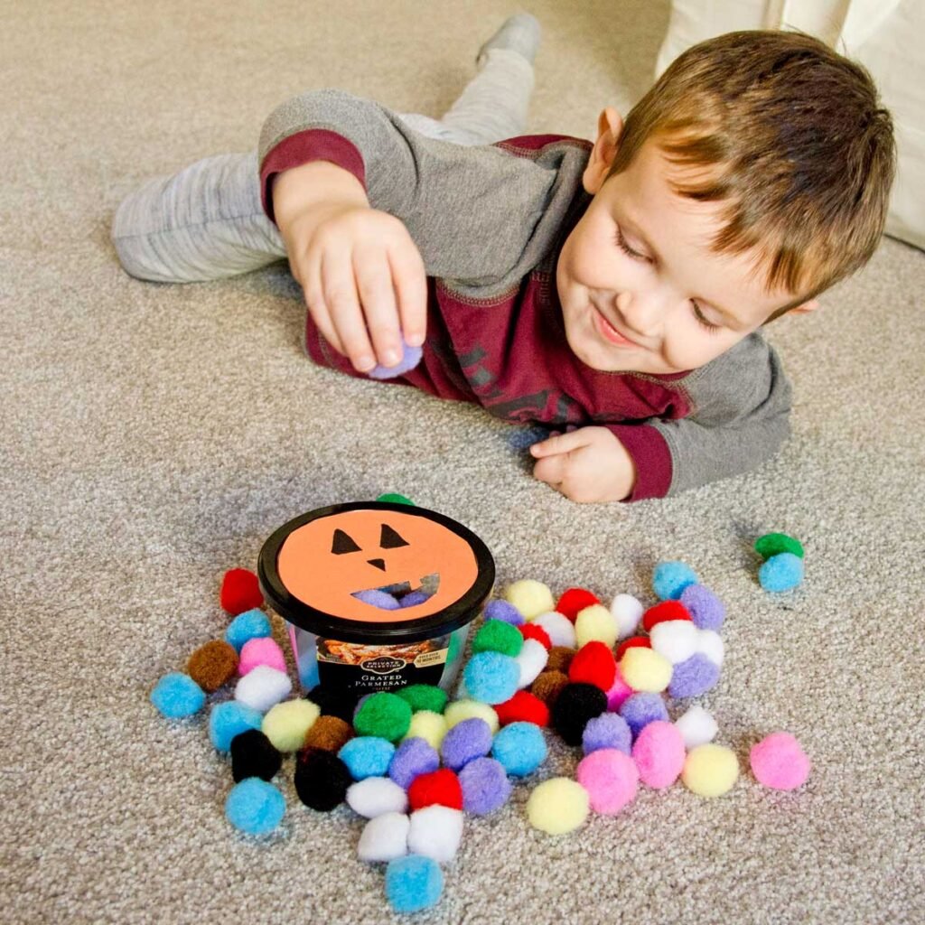 Feed the Pumpkin Halloween Toddler Activity - Busy Toddler