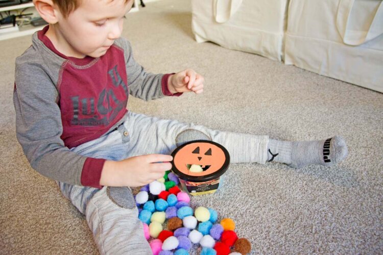 Feed the Pumpkin Halloween Toddler Activity - Busy Toddler