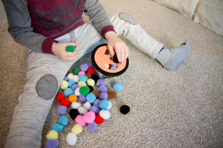 Feed the Pumpkin Halloween Toddler Activity - Busy Toddler