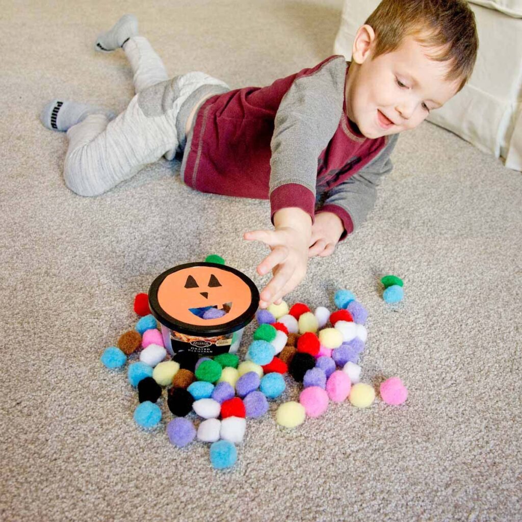 Feed the Pumpkin Halloween Toddler Activity - Busy Toddler