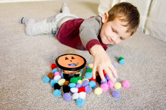 Feed the Pumpkin Halloween Toddler Activity - Busy Toddler
