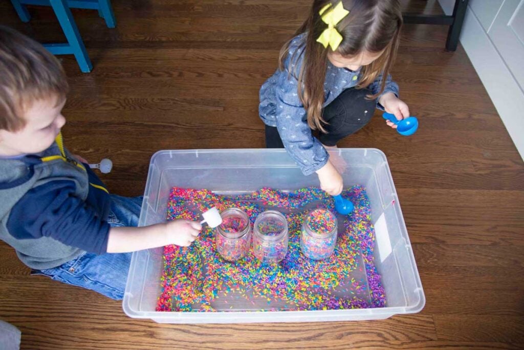 How to Use Rainbow Rice with Toddlers - Busy Toddler