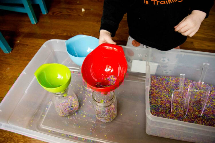 Rainbow Rice and Funnels Sensory Bin - Busy Toddler